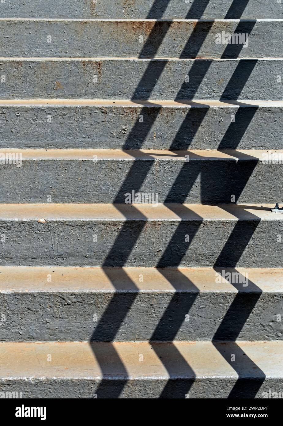 Stair steps and handrail shadow Stock Photo - Alamy