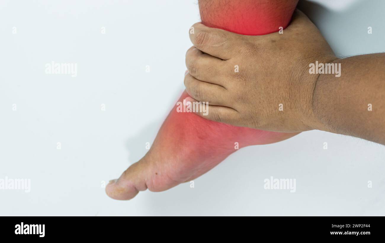 The leg that is injured has the ankle being held with the hand. There ...