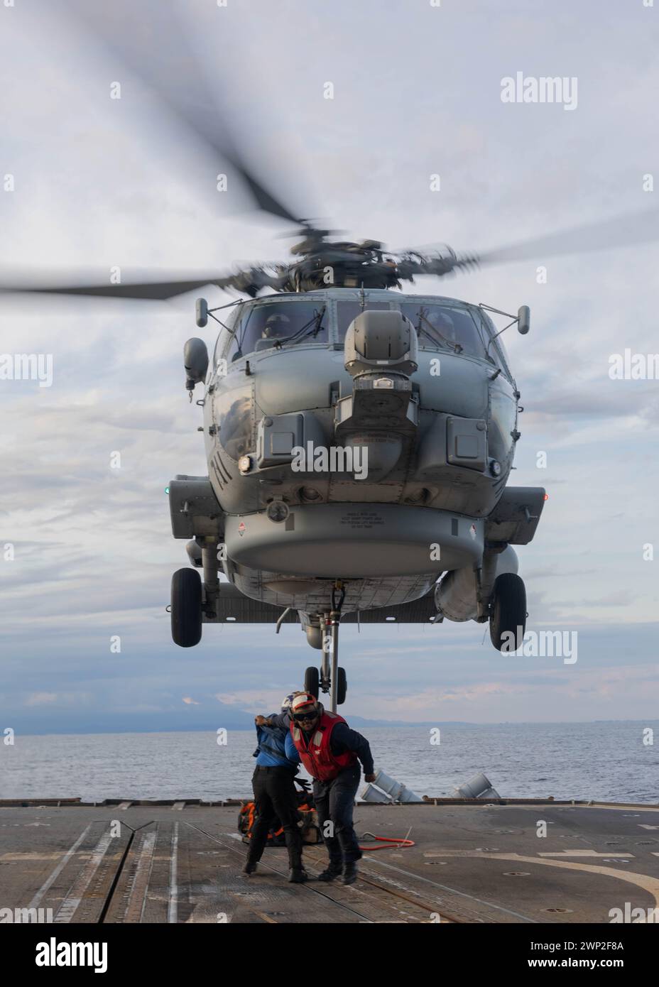 240301-N-DM318-1012 SAGAMI WAN, JAPAN (FEB. 27, 2024) An MH-60R Seahawk ...