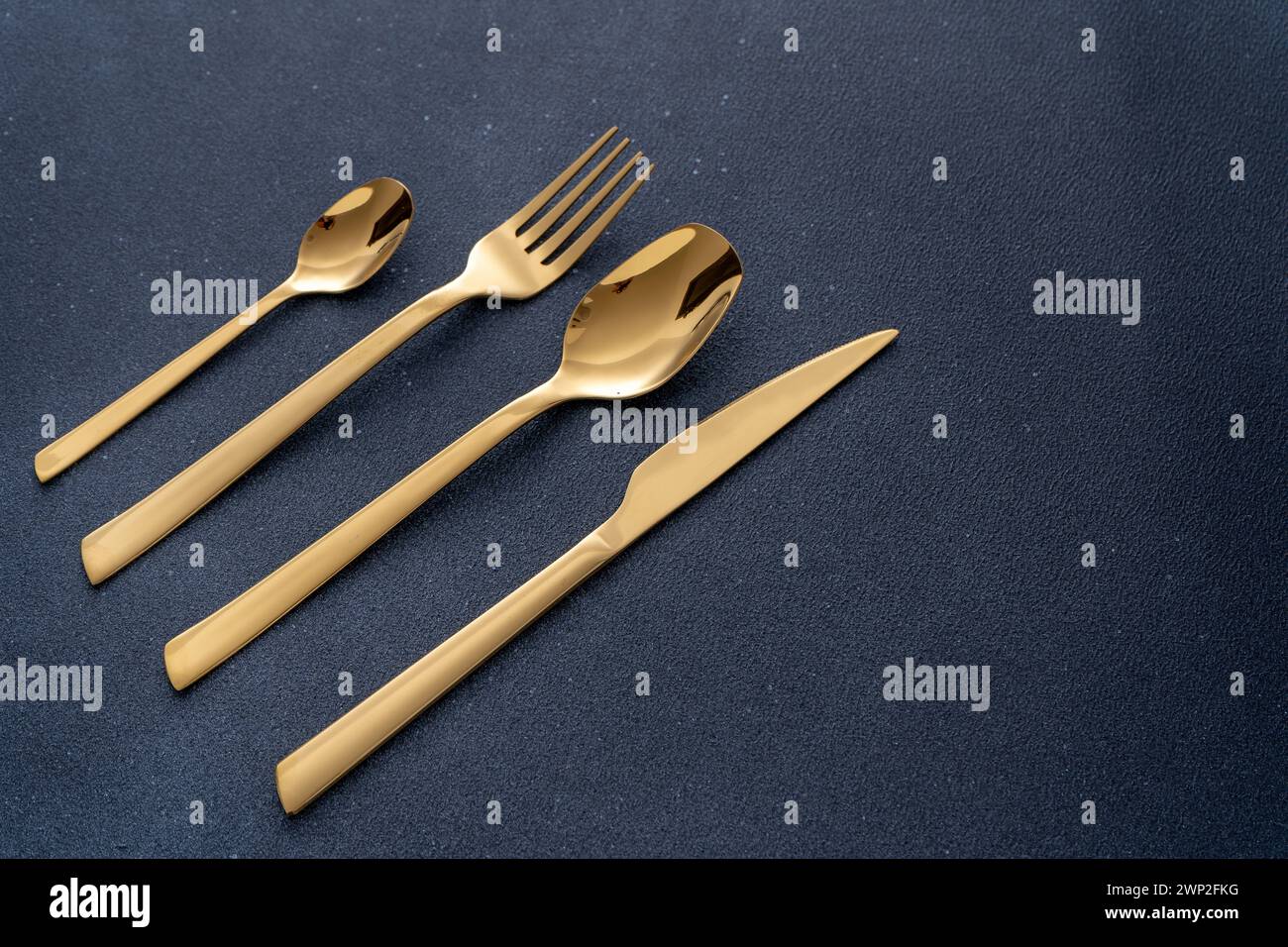 Set of cutlery made of gold metal. Fork, spoon, knife, teaspoon Stock ...