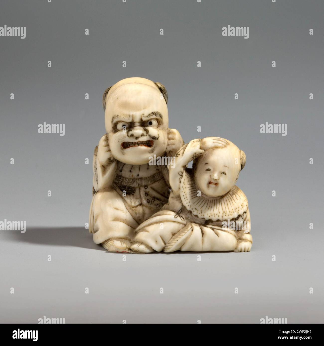 This netsuke by Fukumoto Homin (ca. 1860-1890) depicts two children ...