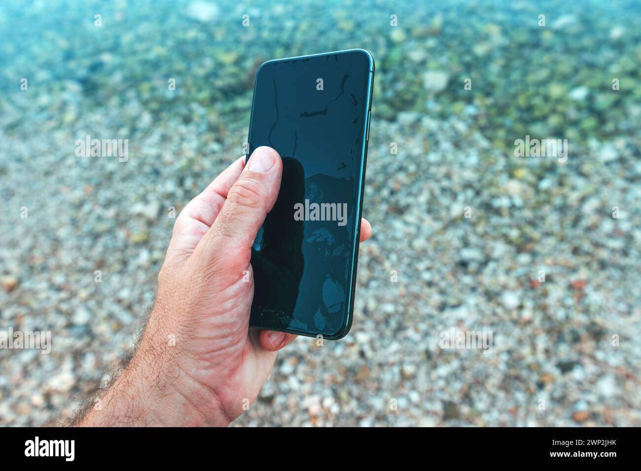 Man waterproof smartphone sea hi-res stock photography and images - Alamy