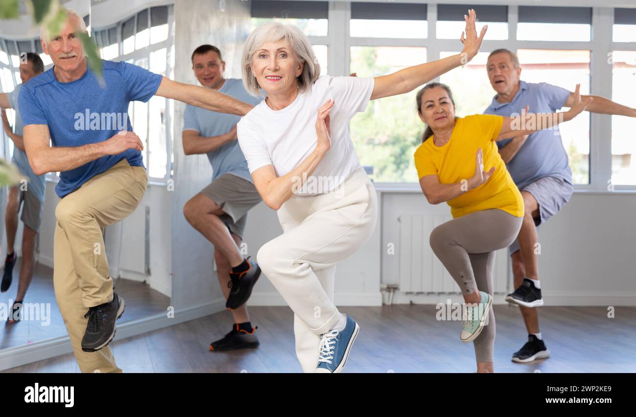 Elderly woman dances modern dances in group Stock Photo - Alamy