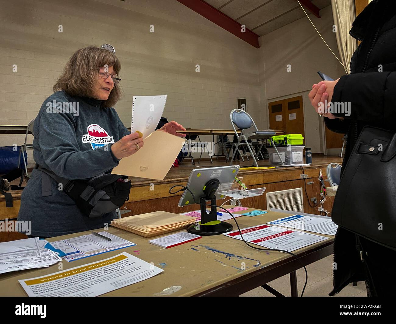 Arlington, Virginia, USA. 5th Mar, 2024. Election worker SUSAN RANDOLPH ...