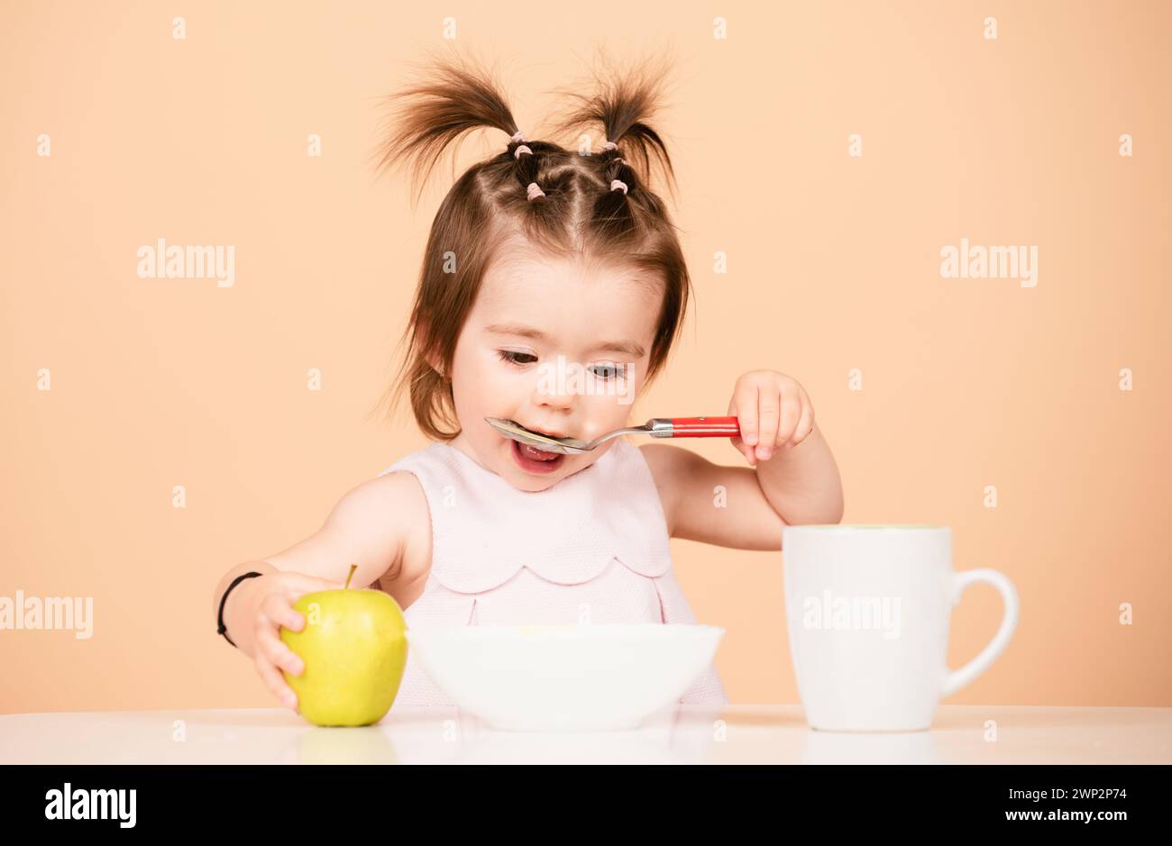 Cute baby child eat food, babies eating. Kid eating healthy food with a ...