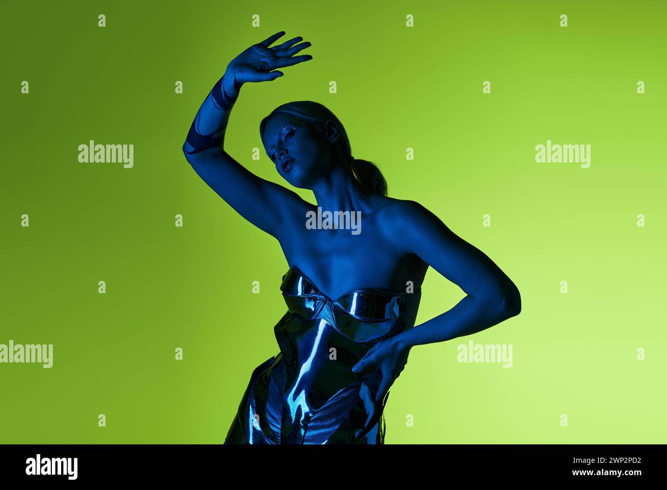 peculiar alluring woman in futuristic sci fi attire posing in blue ...