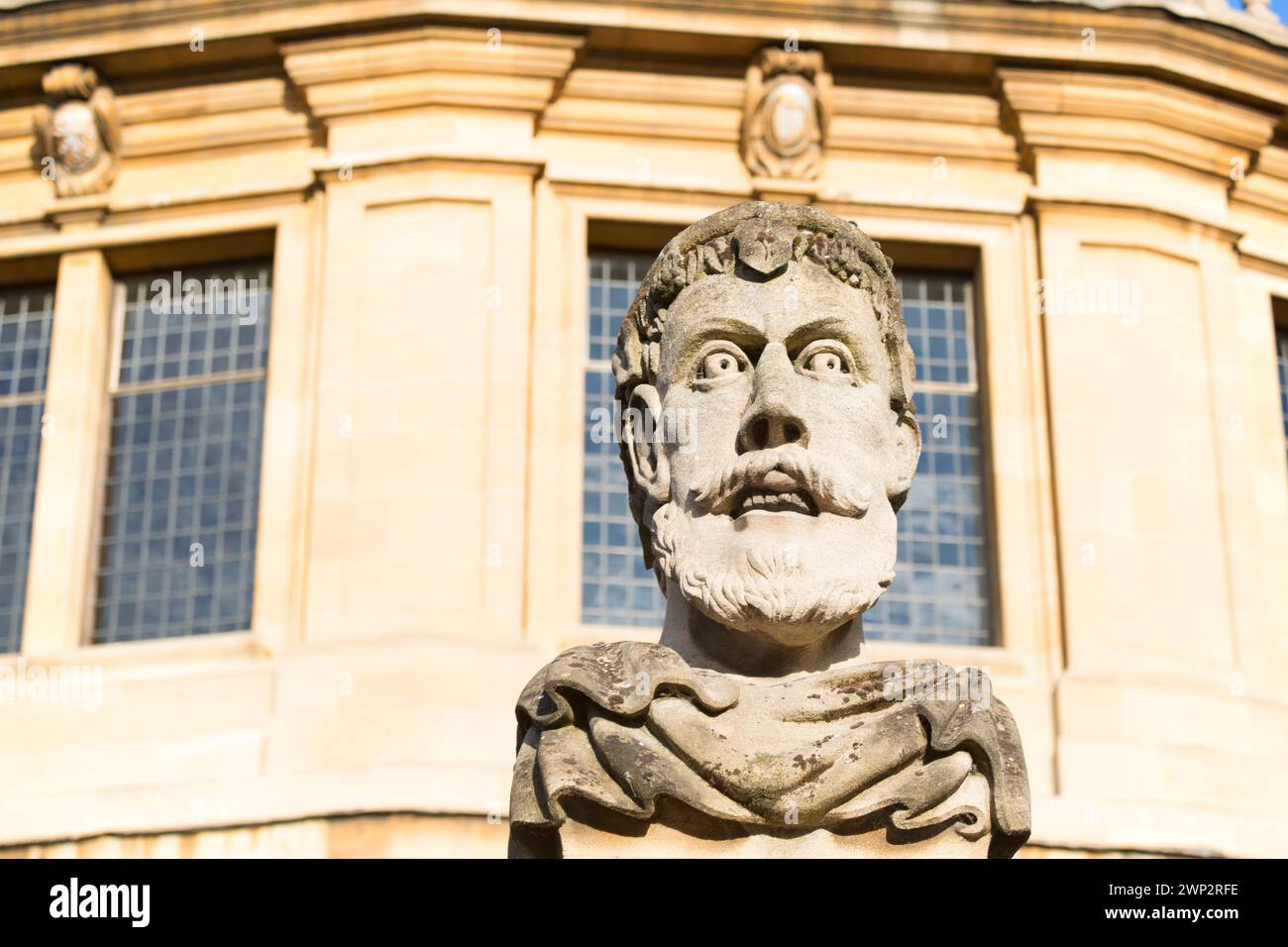 UK, Oxford, Emperor Heads, Stonework on Wren's Sheldonian Theatre Stock Photo - Alamy