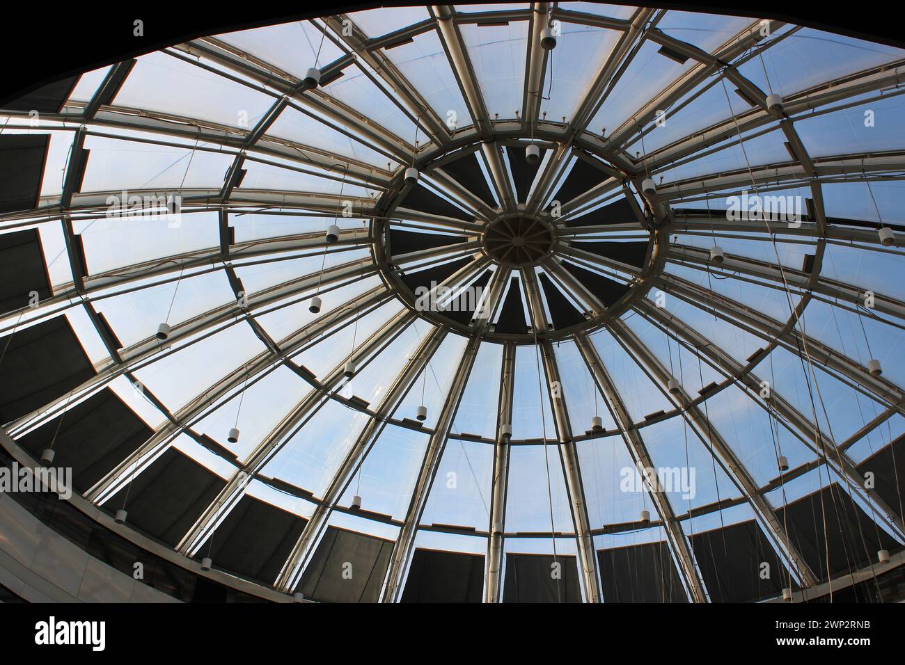 Metal structure of a round glass roof with ceiling spotlights Stock ...