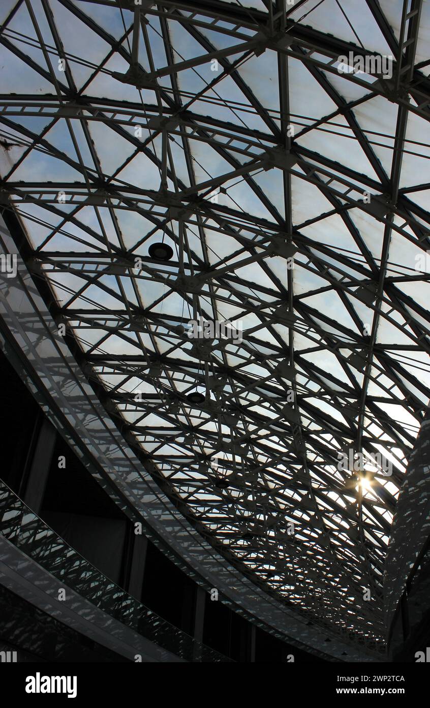 Futuristic metal and glass roof with ceiling elements in modern ...