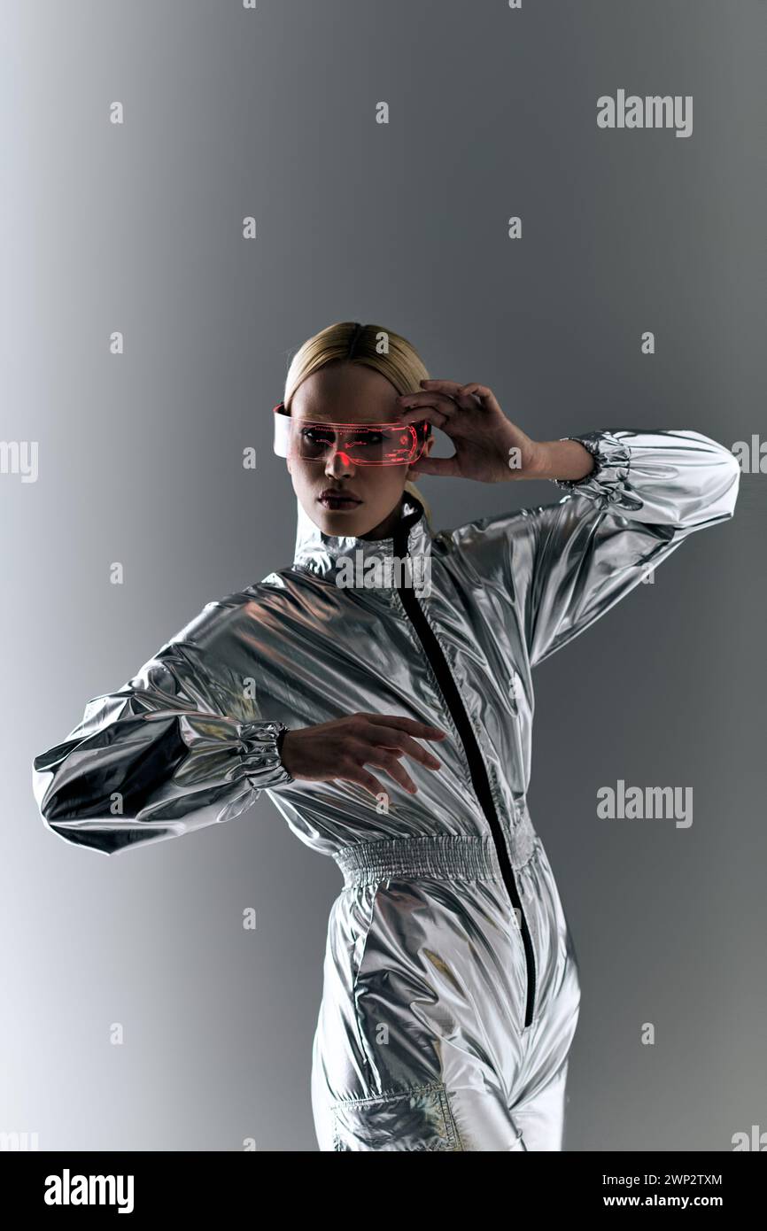 peculiar woman with sci fi glasses in futuristic attire doing robotic ...