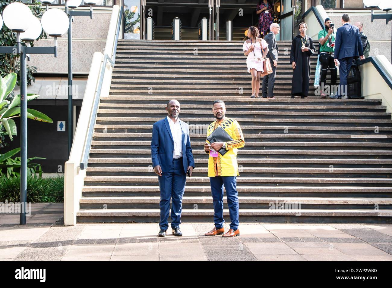 Delegates stand outside the main plenary hall at the United Nations ...