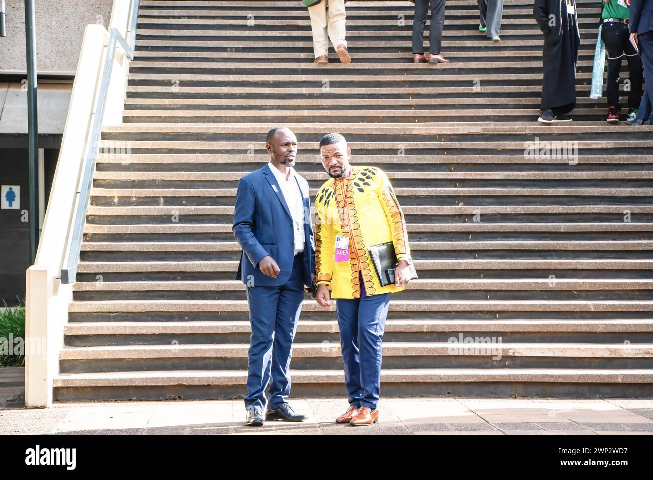 Delegates stand hi-res stock photography and images - Alamy