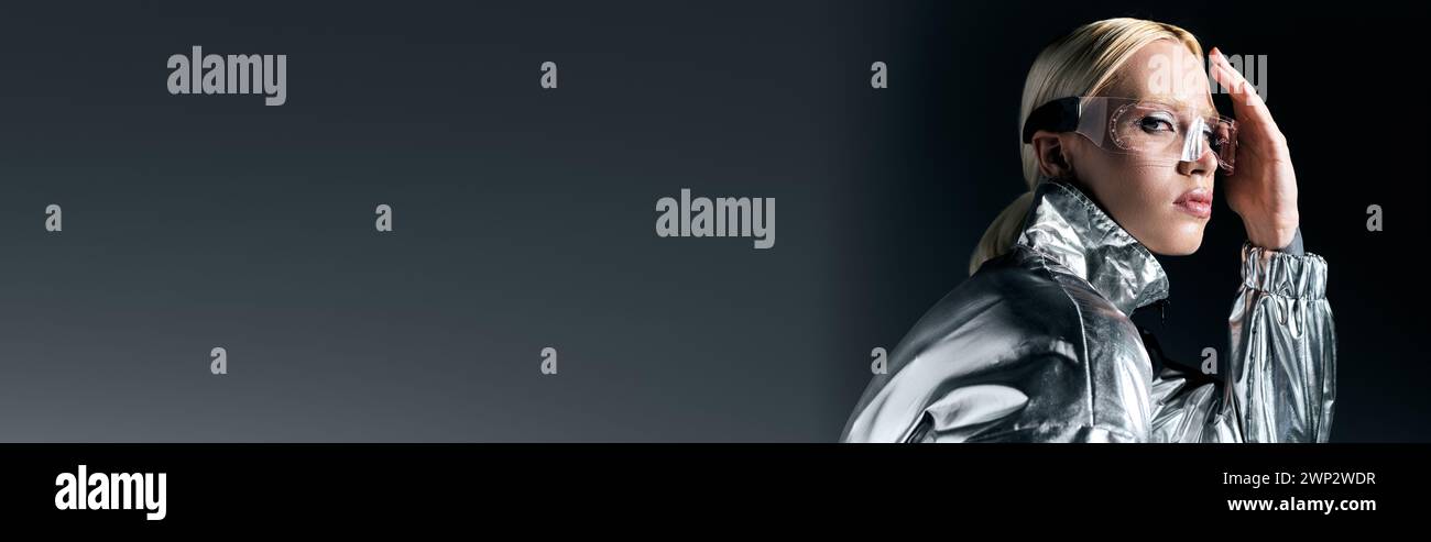 peculiar woman in sci fi glasses and silver attire looking at camera on ...