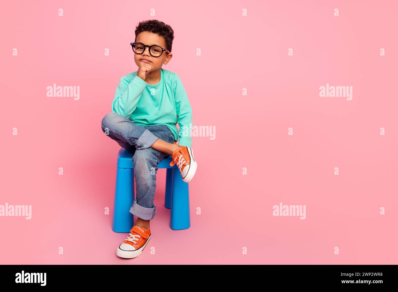 Full size photo of charming small boy sit chair minded face specs wear ...