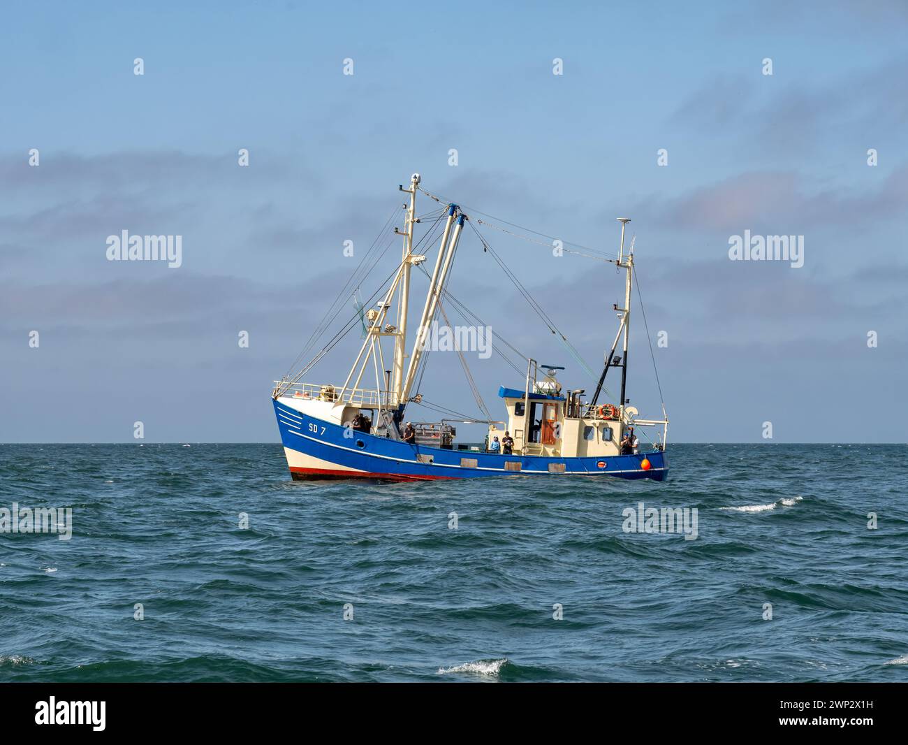 People fishing on trawler in German Bight, North Sea near Helgoland ...
