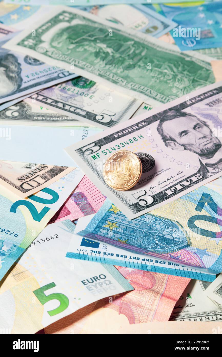 A gold-colored coin with a denomination of 10 Russian rubles lies on ...