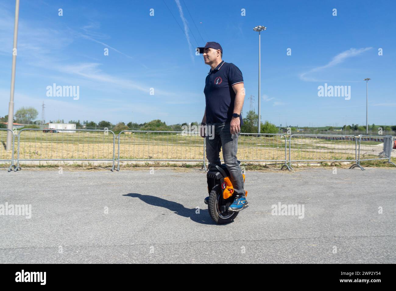 ROME, ITALY - February 19 2024: Man riding on monowheel. Man driving ...