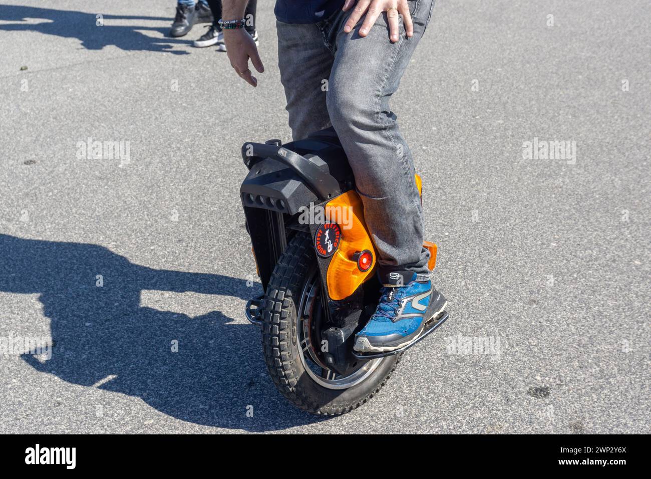 ROME, ITALY - February 19 2024: Man riding on monowheel. Man driving ...
