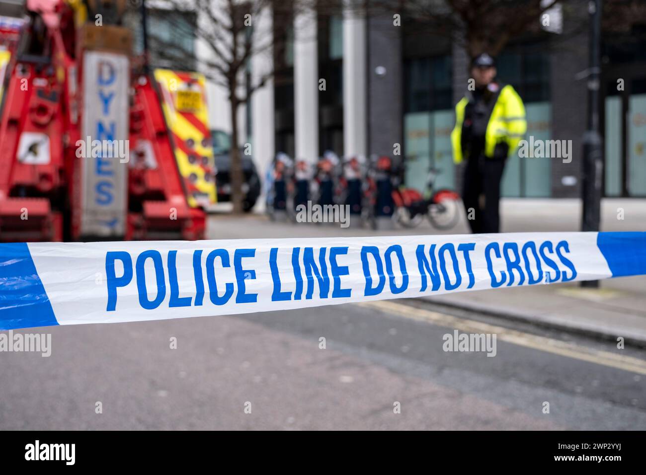 Police line, do not cross tape surrounding the aftermath of a double ...