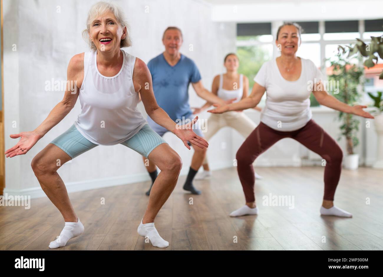 Group of people of different ages dancing in studio Stock Photo - Alamy