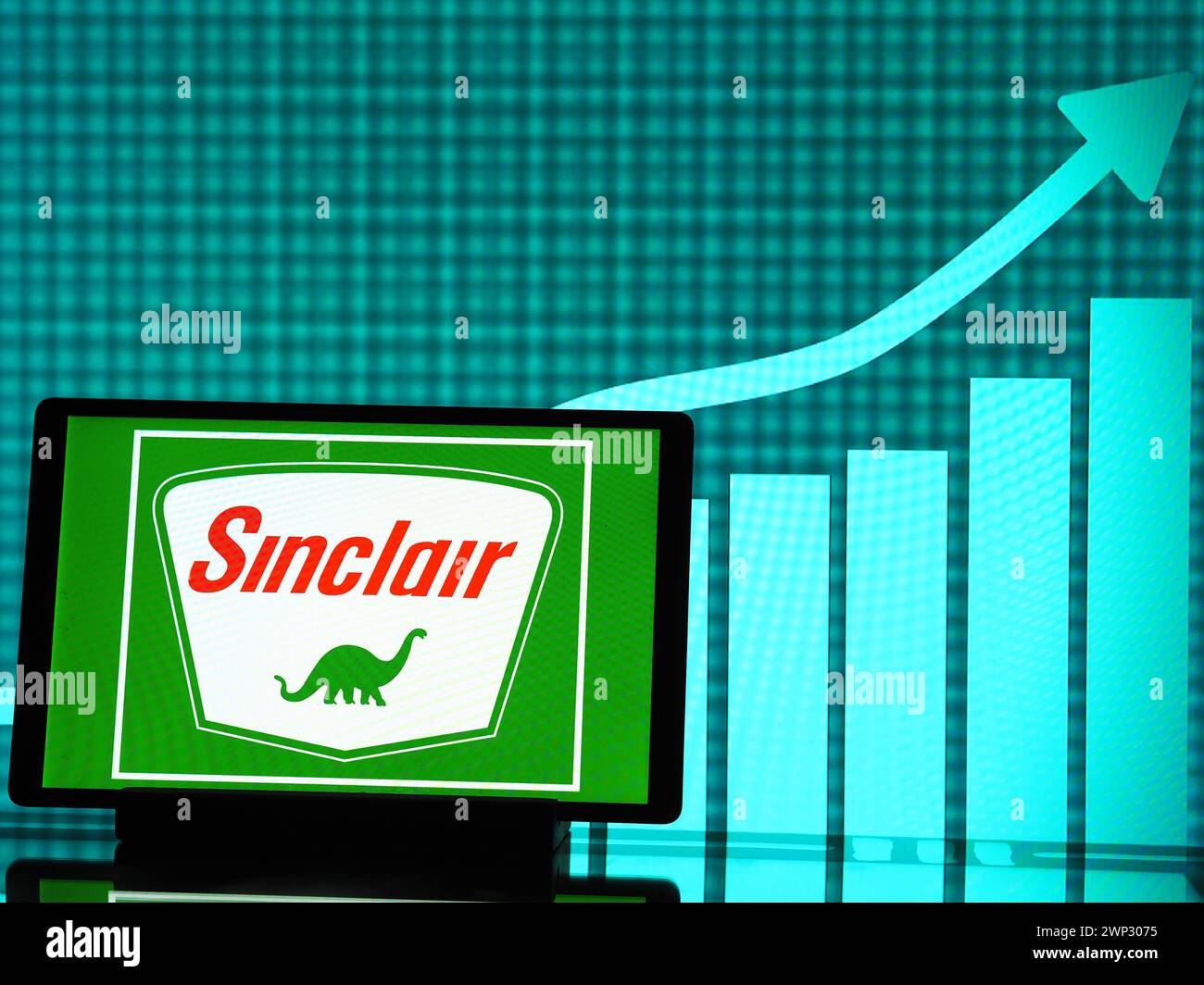 In this photo illustration, the HF Sinclair Corporation logo seen displayed on a tablet Stock ...