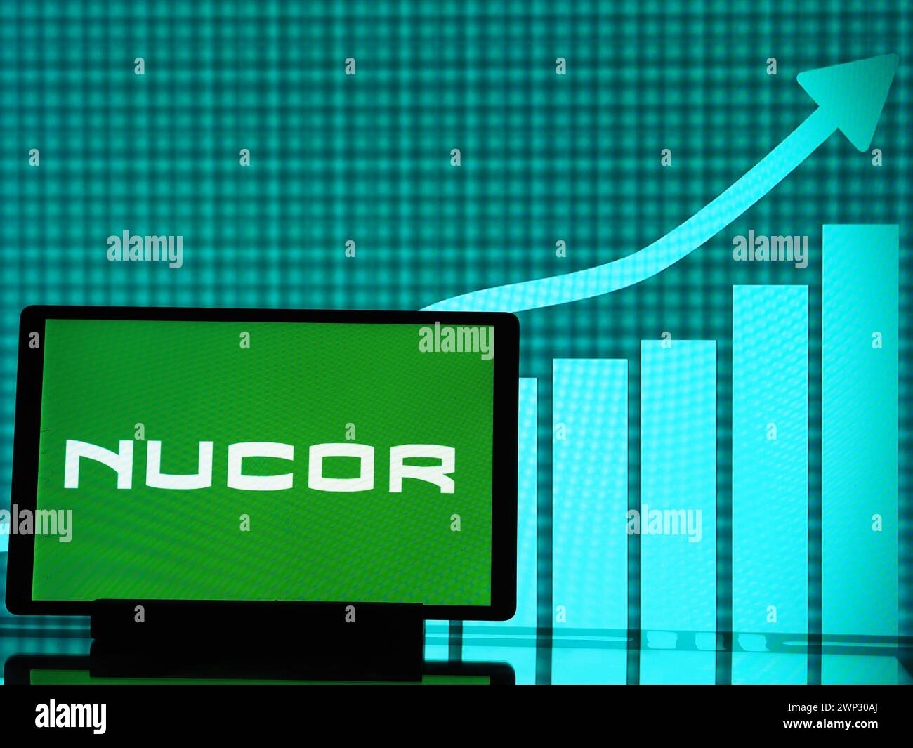 In this photo illustration, the Nucor Corporation logo seen displayed ...