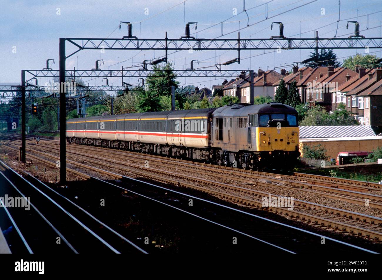 A Class 31 diesel locomotive number 31461 at the head of an up empty ...