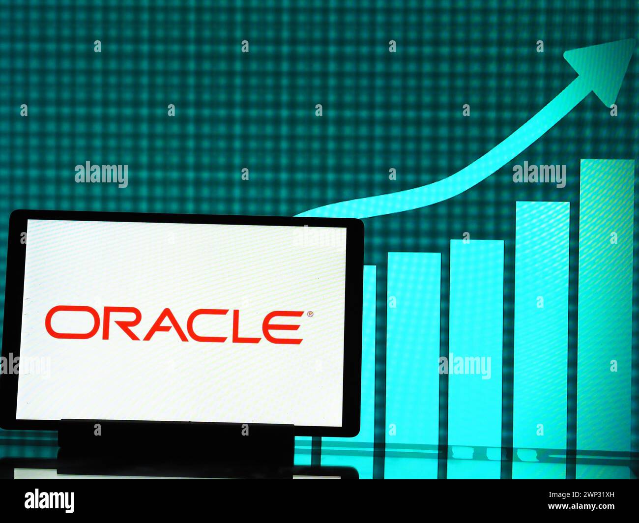 In this photo illustration, the Oracle Corporation logo seen displayed ...