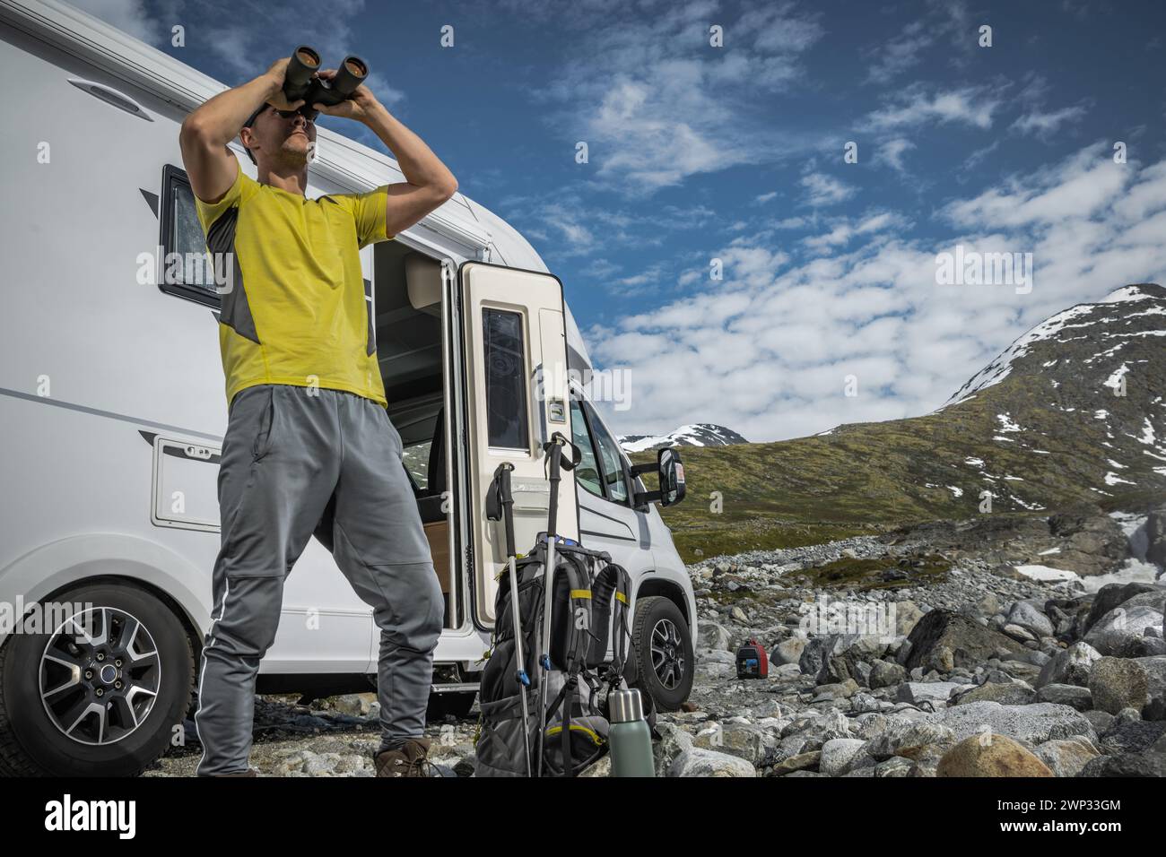 Caucasian Camper Van RV Owner on a Road Trip Spotting Wildlife Using ...