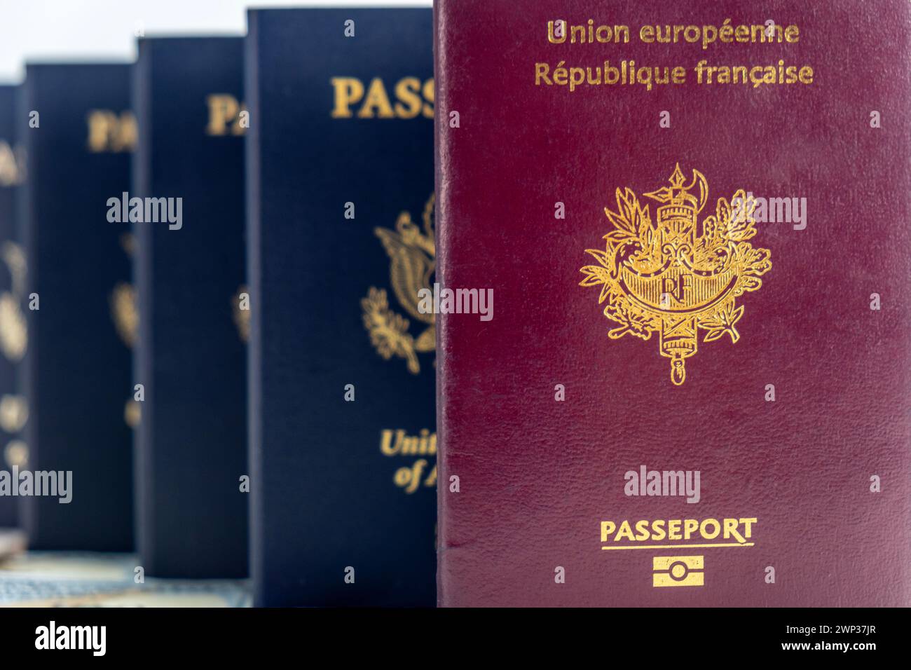 4 United States and 1 France passport on currency transparent ...