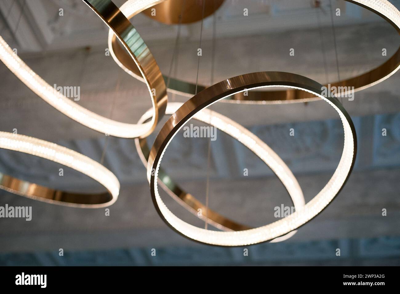 Chandelier on the concrete ceiling. Circles or rings. Luminaire design ...