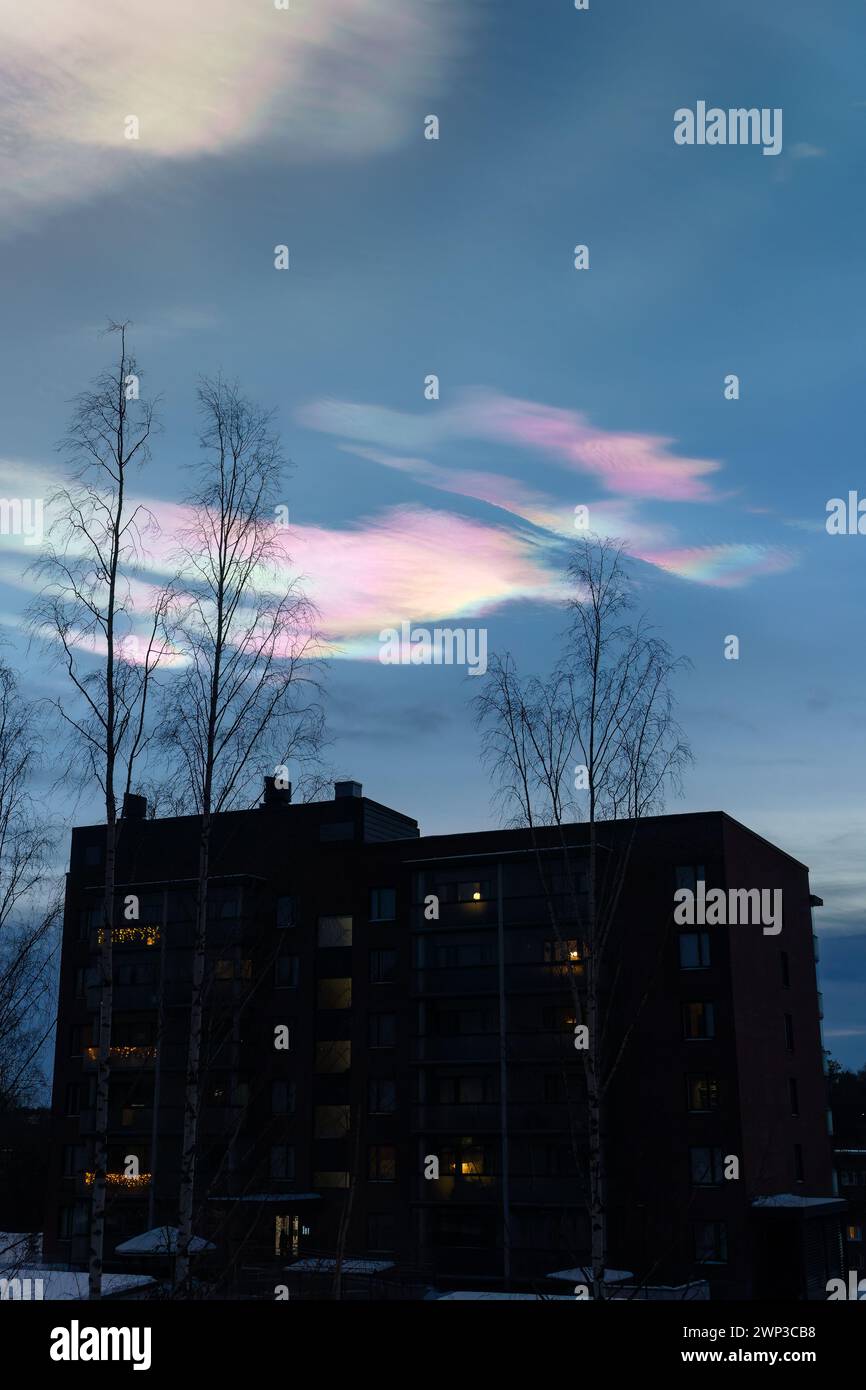 Iridescent clouds (Rainbow clouds) in the evening, above the apartment ...