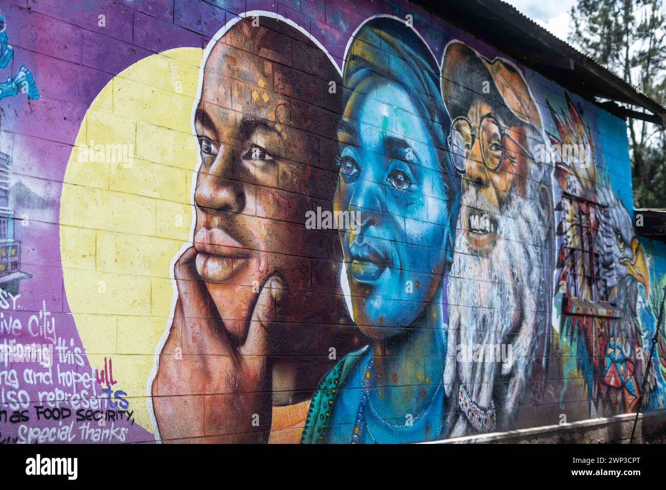 A mural depicting faces of people is seen painted on a wall in Nakuru ...
