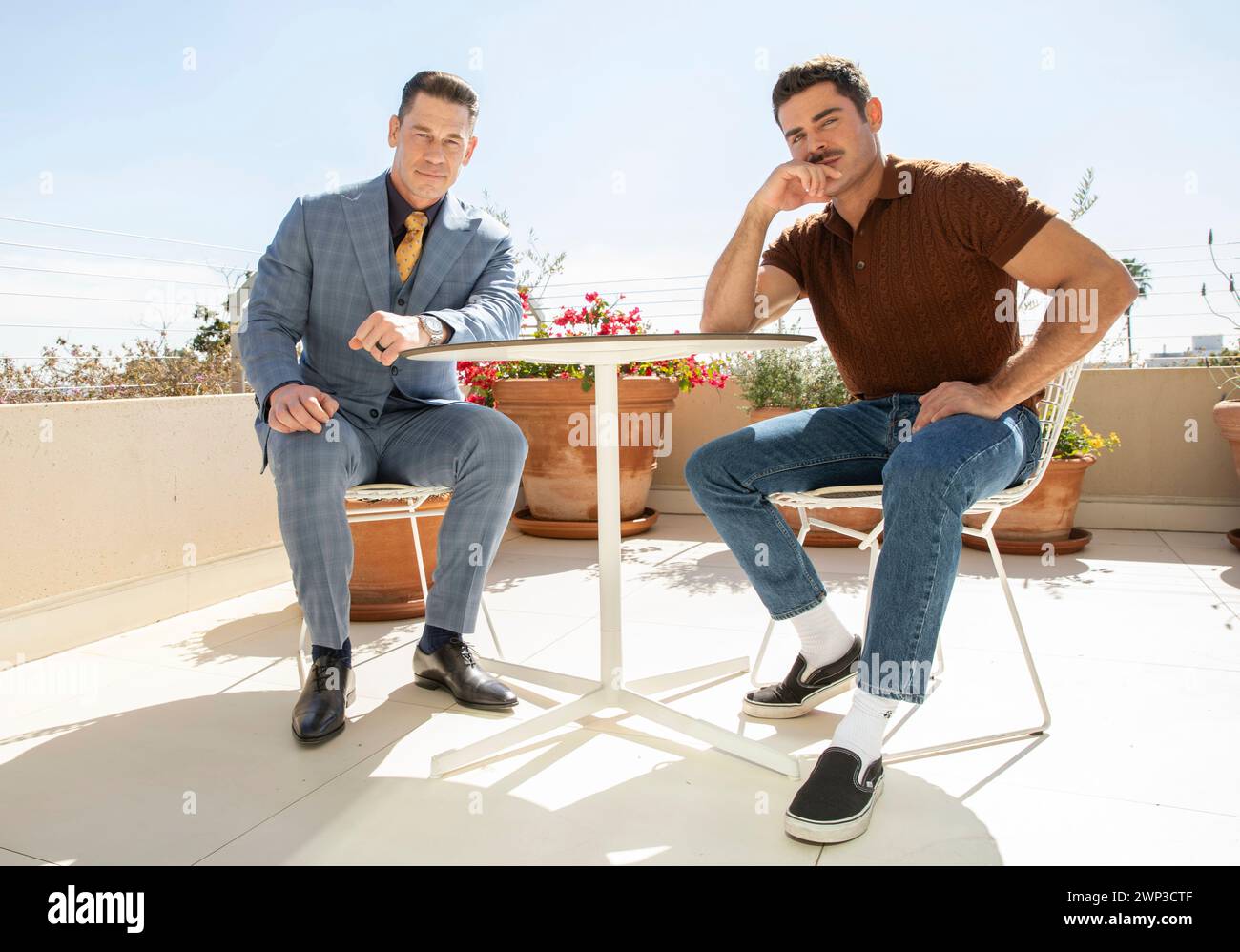 John Cena, left, and Zac Efron pose for a portrait to promote their ...