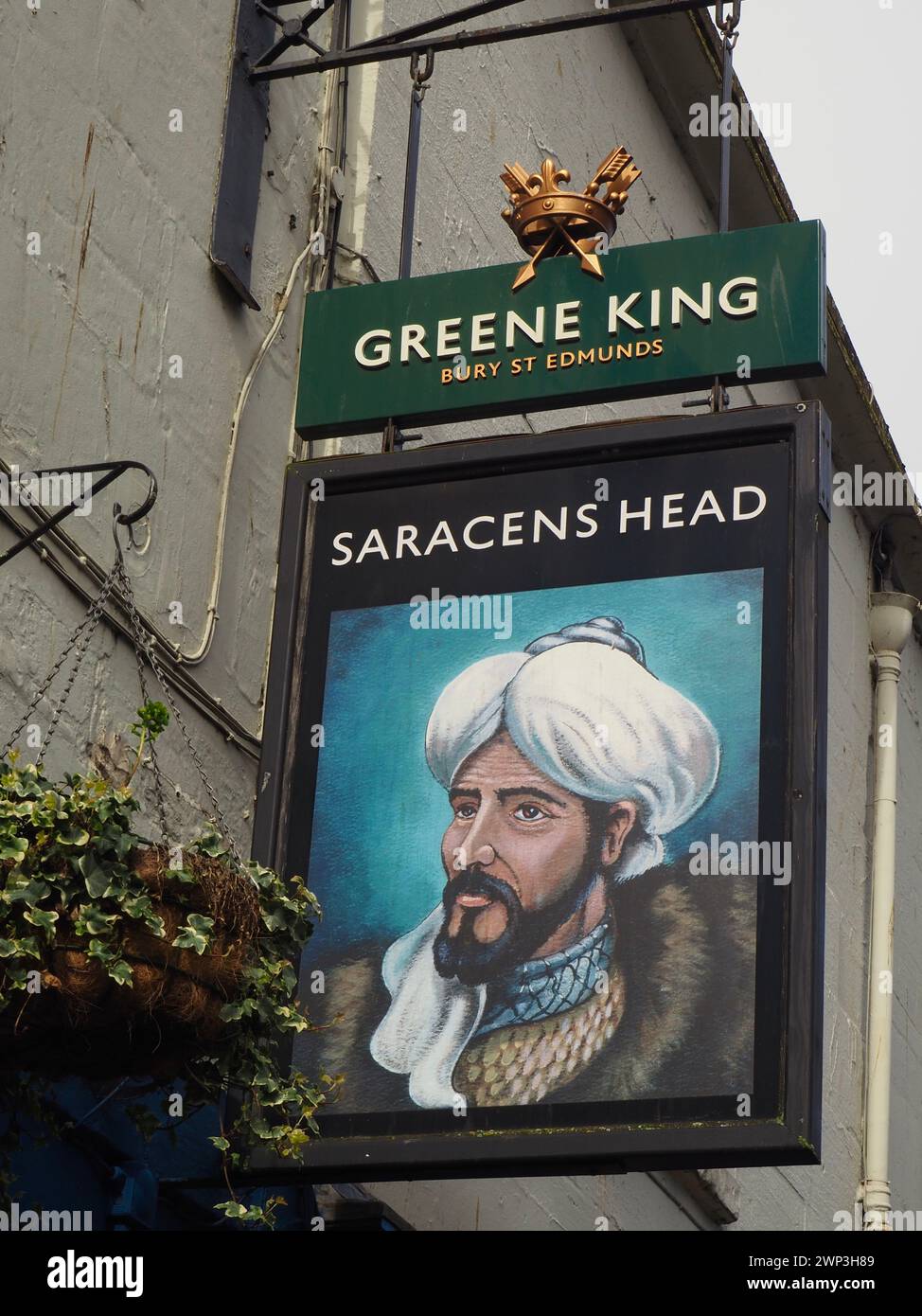 Signboard of the Saracens Head pub, a former coaching inn, one of the ...