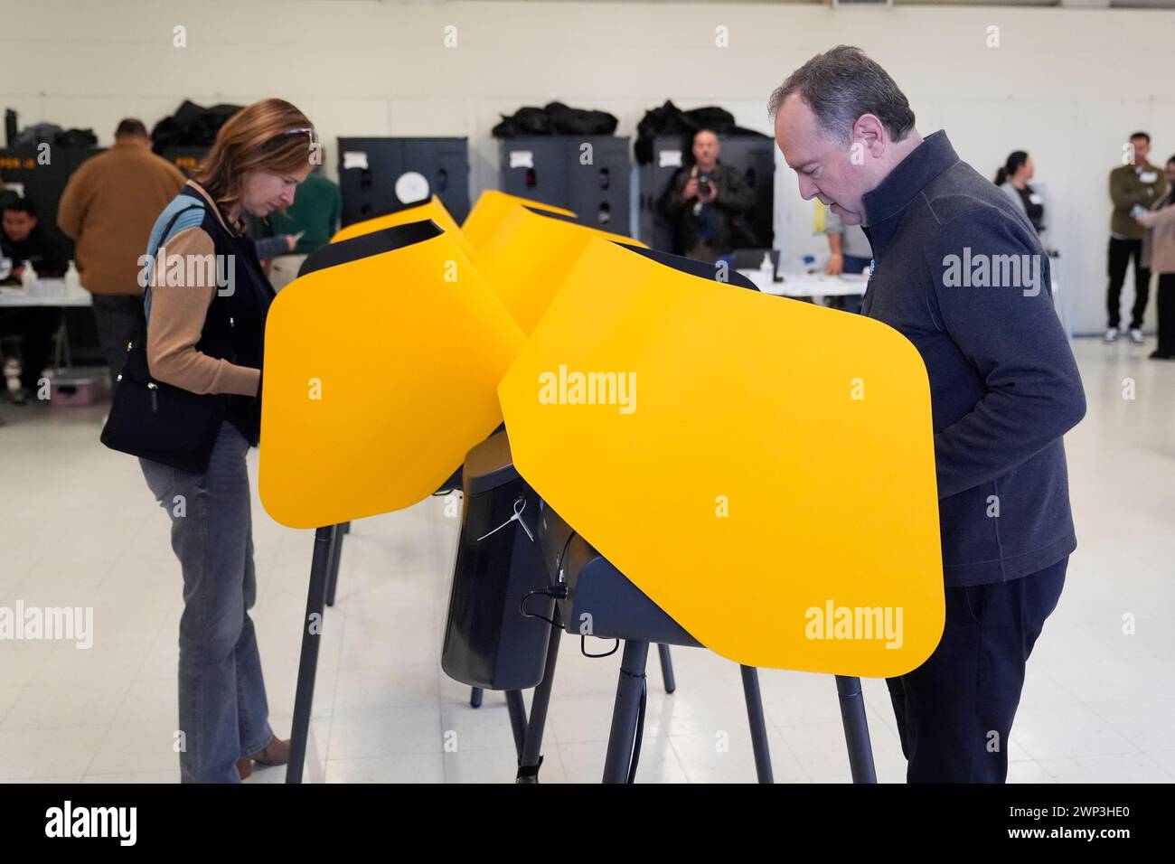 Rep. Adam Schiff, D-Calif., right, votes Tuesday, March 5, 2024, in ...
