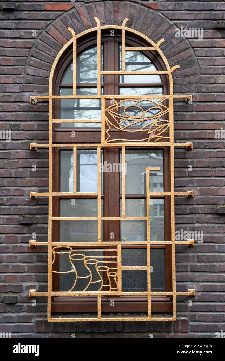 large window with gold-colored grille Stock Photo - Alamy