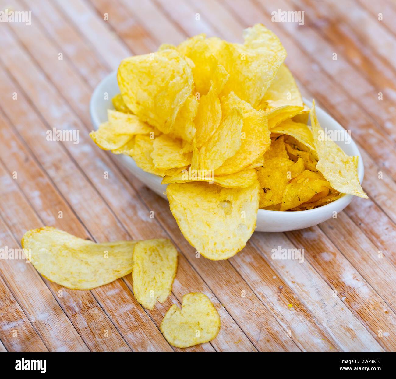Crispy salty potato chips with natural taste on plate Stock Photo - Alamy
