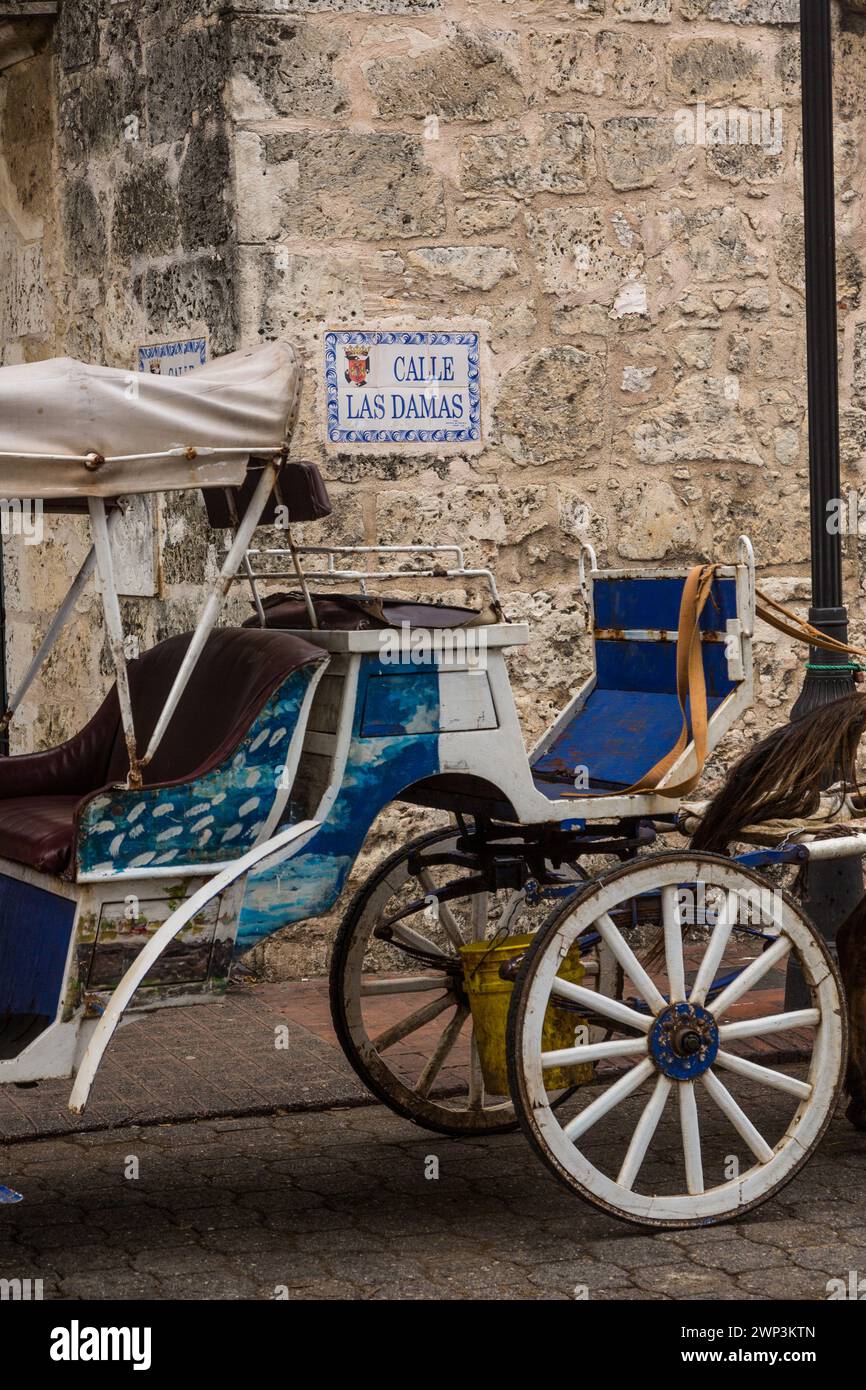 Painted horse-drawn carriage waiting for passengers in the old Colonial ...