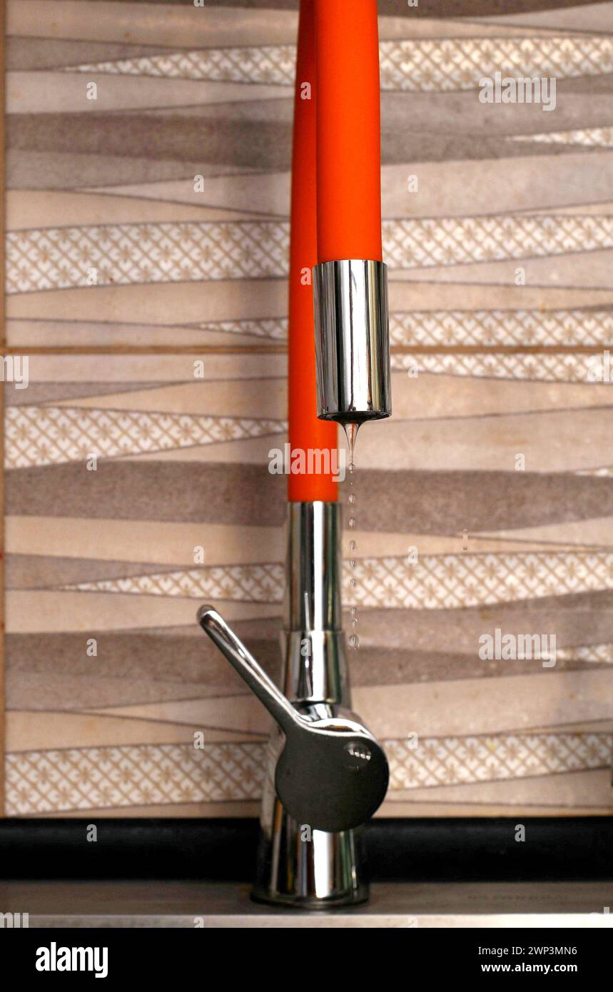 Pictured is a domestic tap mixer tap with water drops flowing out Stock ...