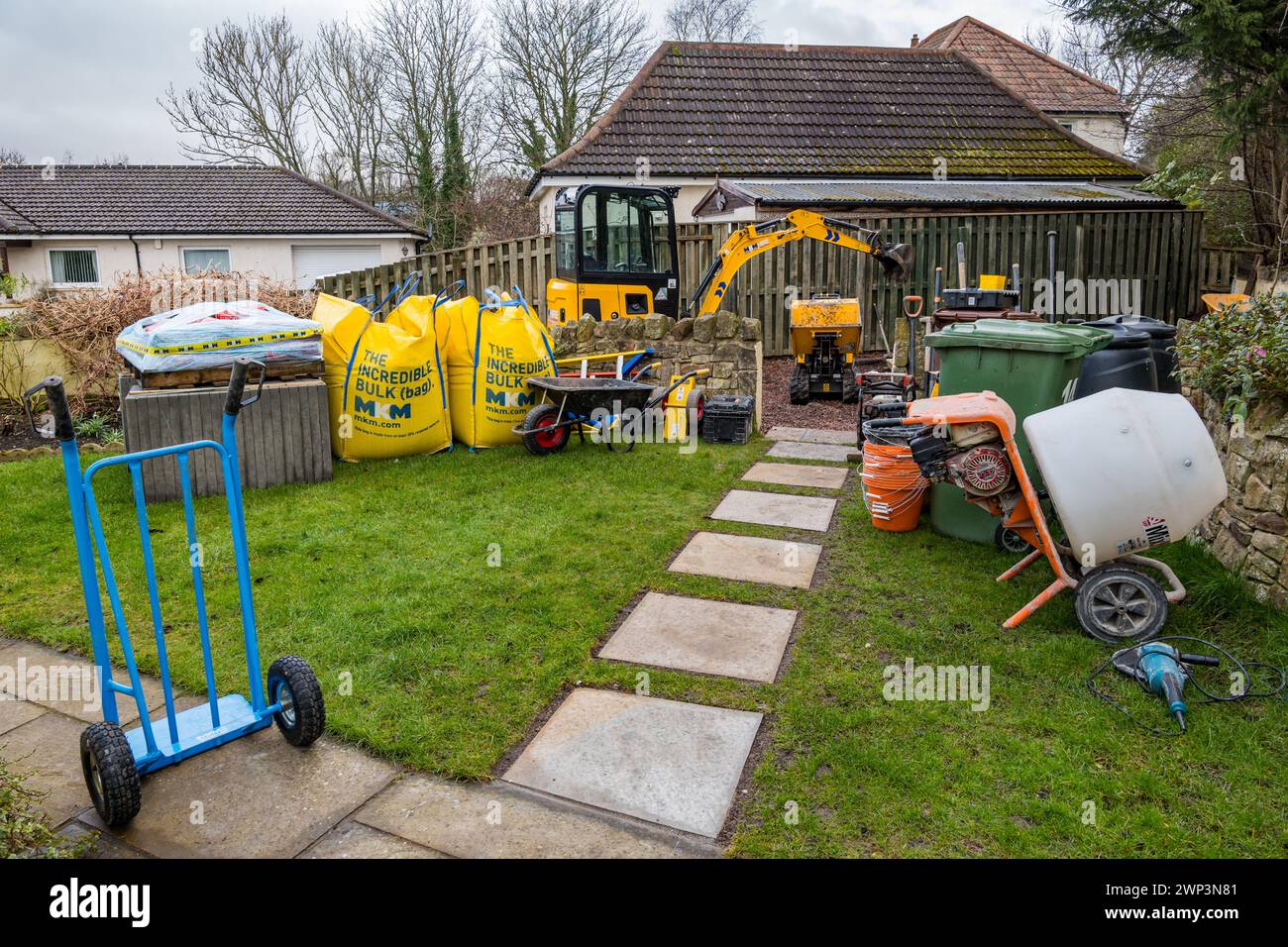 Machinery (small digger, dumper & cement mixer) for construction work ...