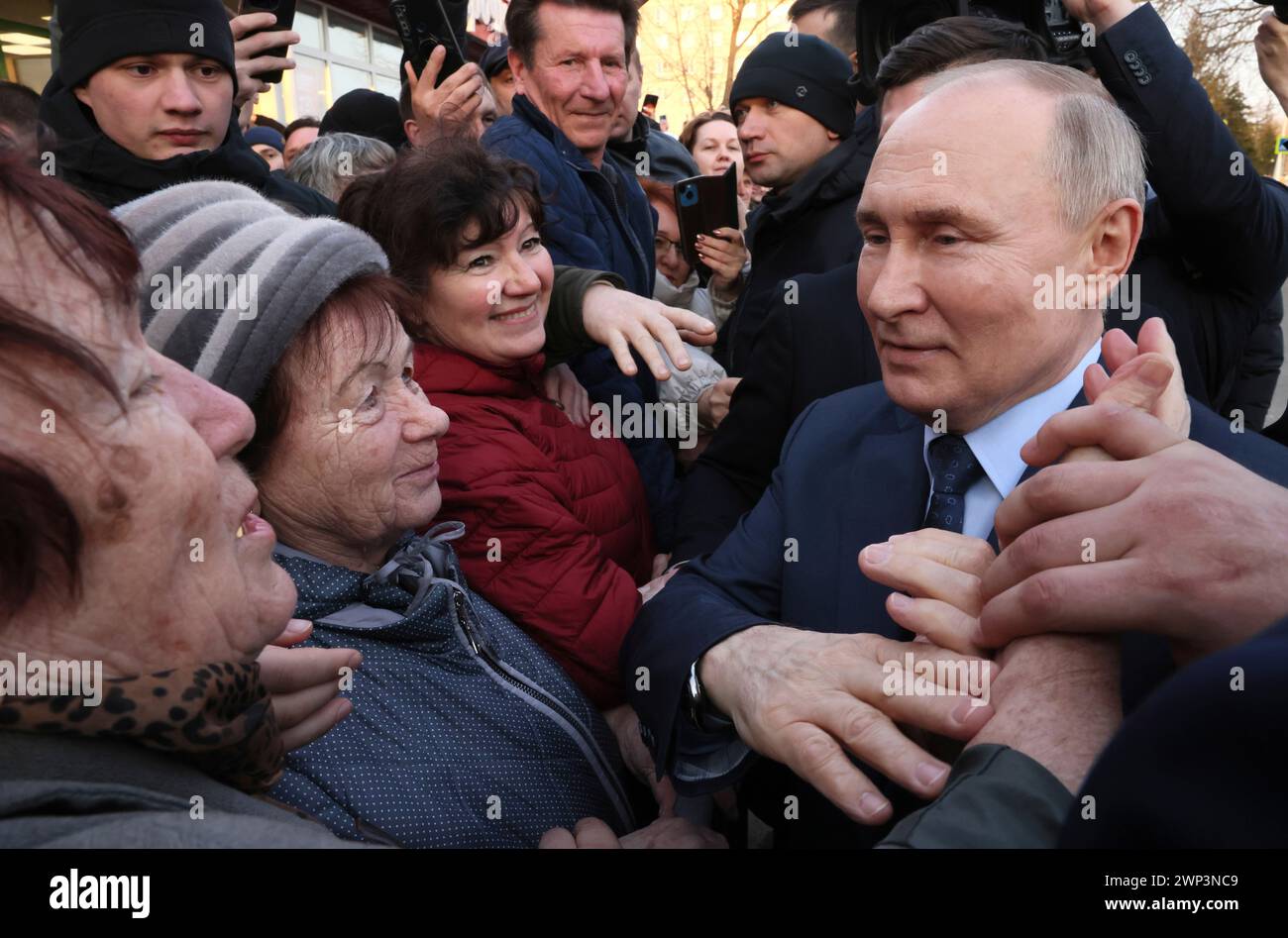 Russian President Vladimir Putin meets with local residents following a ...