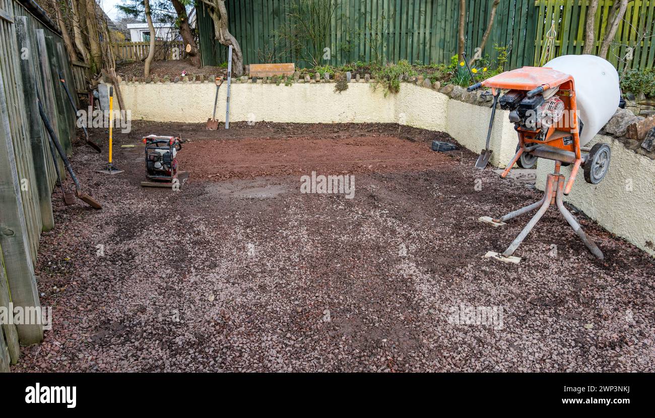 ard core base ready for slabs with cement mixer in a driveway to build ...