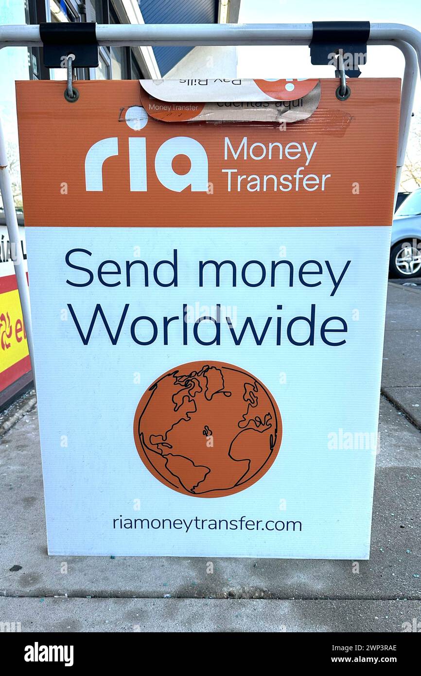 A money transfer sign is displayed in Mount Prospect, Ill., Monday, Feb ...