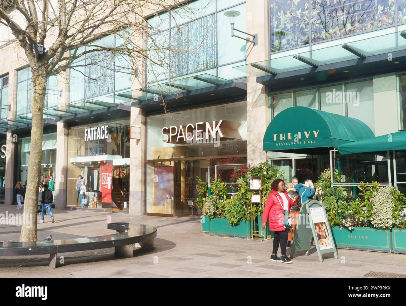 People enjoy an early spring sunny day in Cardiff city centre. Shipping ...