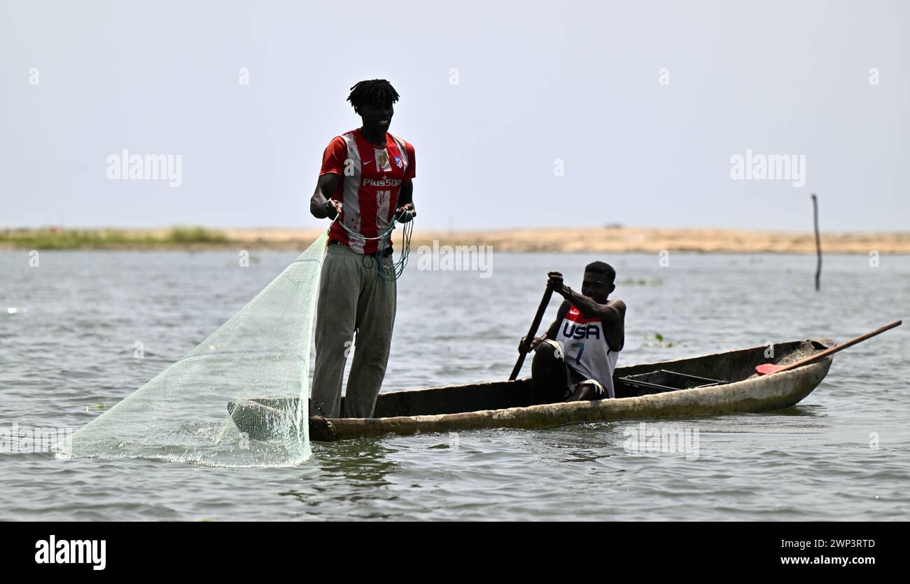 Abidjan, Ivory Coast. 05th Mar, 2024. A boat with two young fishermen ...