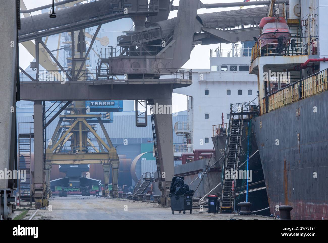 Rostock, Germany. 28th Feb, 2024. Cargo ships moored at the bulk goods ...