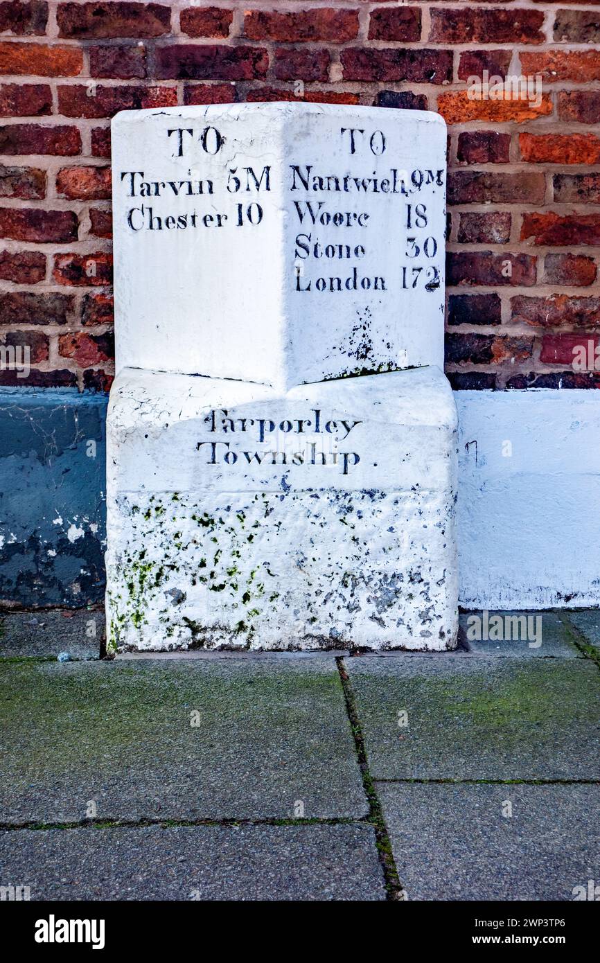 Old stone milestone in the Cheshire village of Tarporley Stock Photo ...