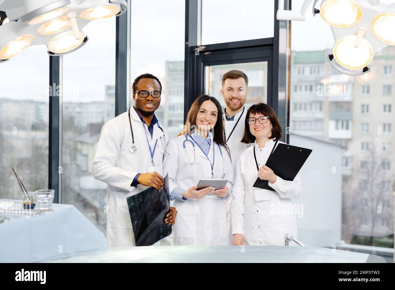 Group of doctors standing together in hospital setting Stock Photo - Alamy