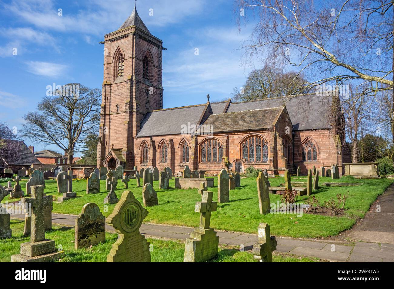 The parish church and churchyard of St Helen's in the Cheshire village ...